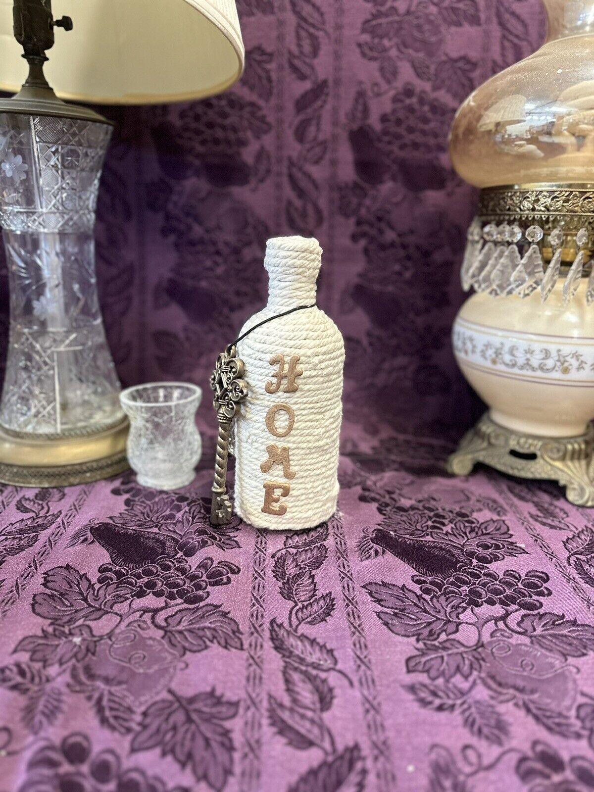 Decorative Glass Vodka Bottle Wrapped in a Cream Rope Home in wood let ...
